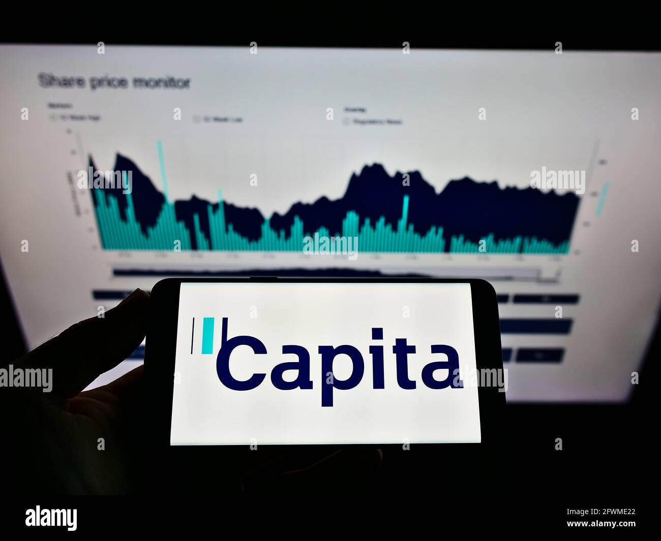 Person holding smartphone with business logo of British process ...