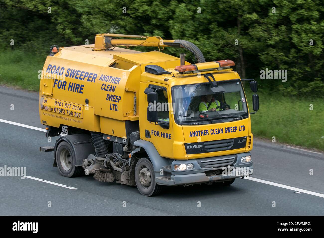 DAF road sweeper for hire road maintenance vehicle driving on the M6 ...