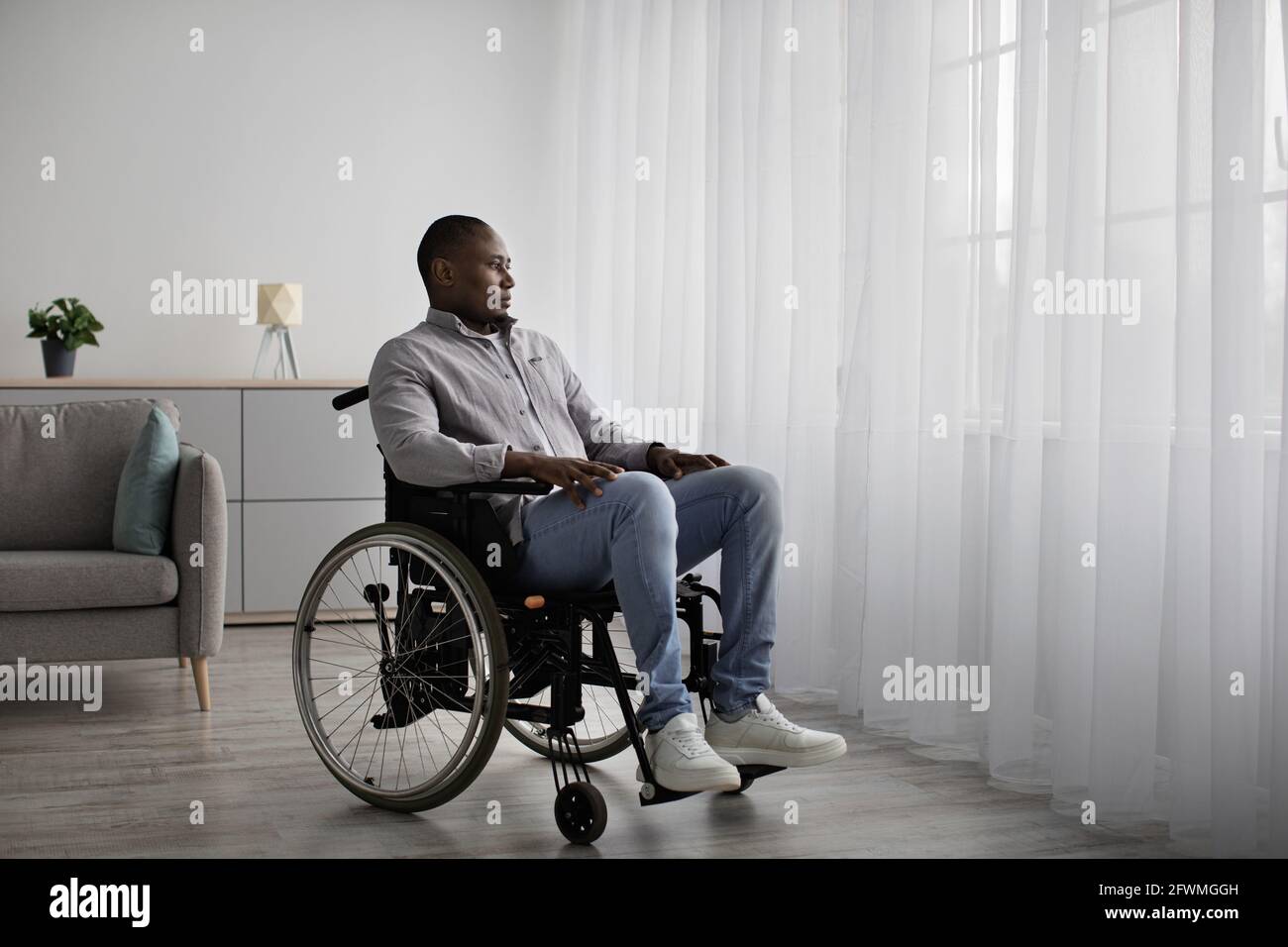 Sad disabled person feeling lonely at home or clinic. Depression on ...