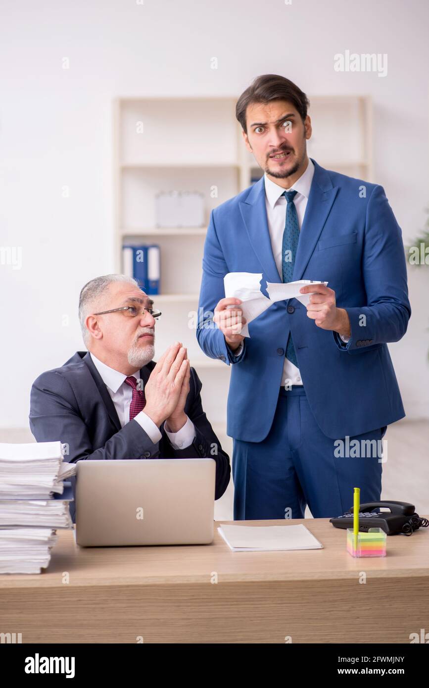 Two employees in dismissal concept Stock Photo - Alamy