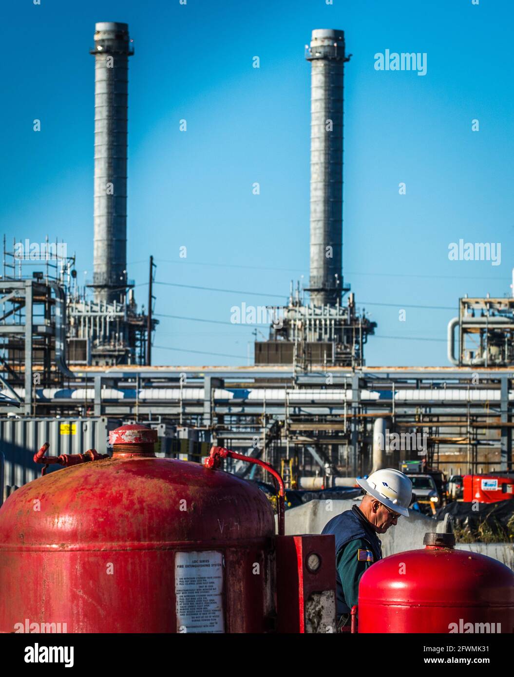 Oil refinery, industrial workers Stock Photo - Alamy