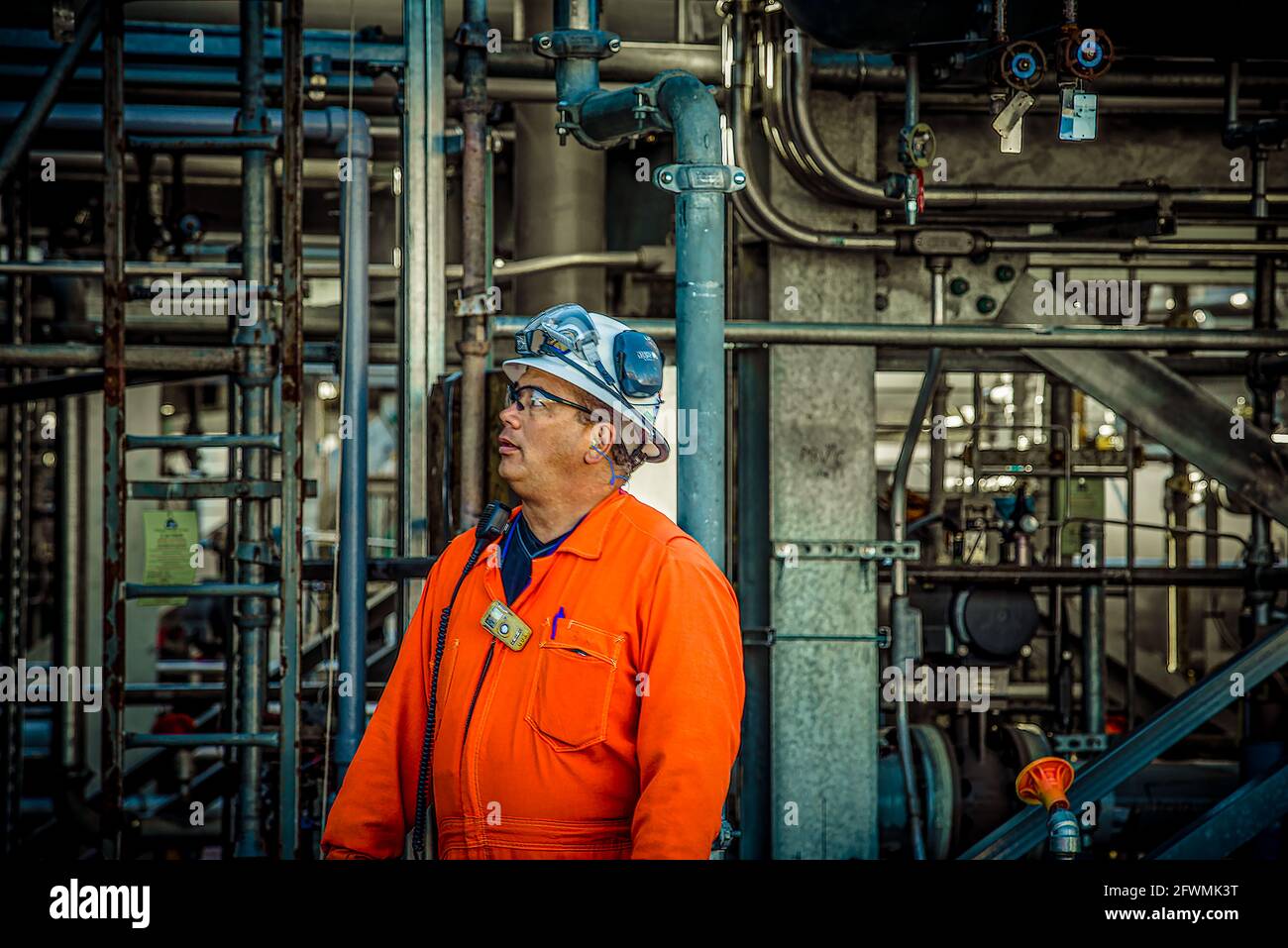 Oil refinery, industrial workers Stock Photo - Alamy