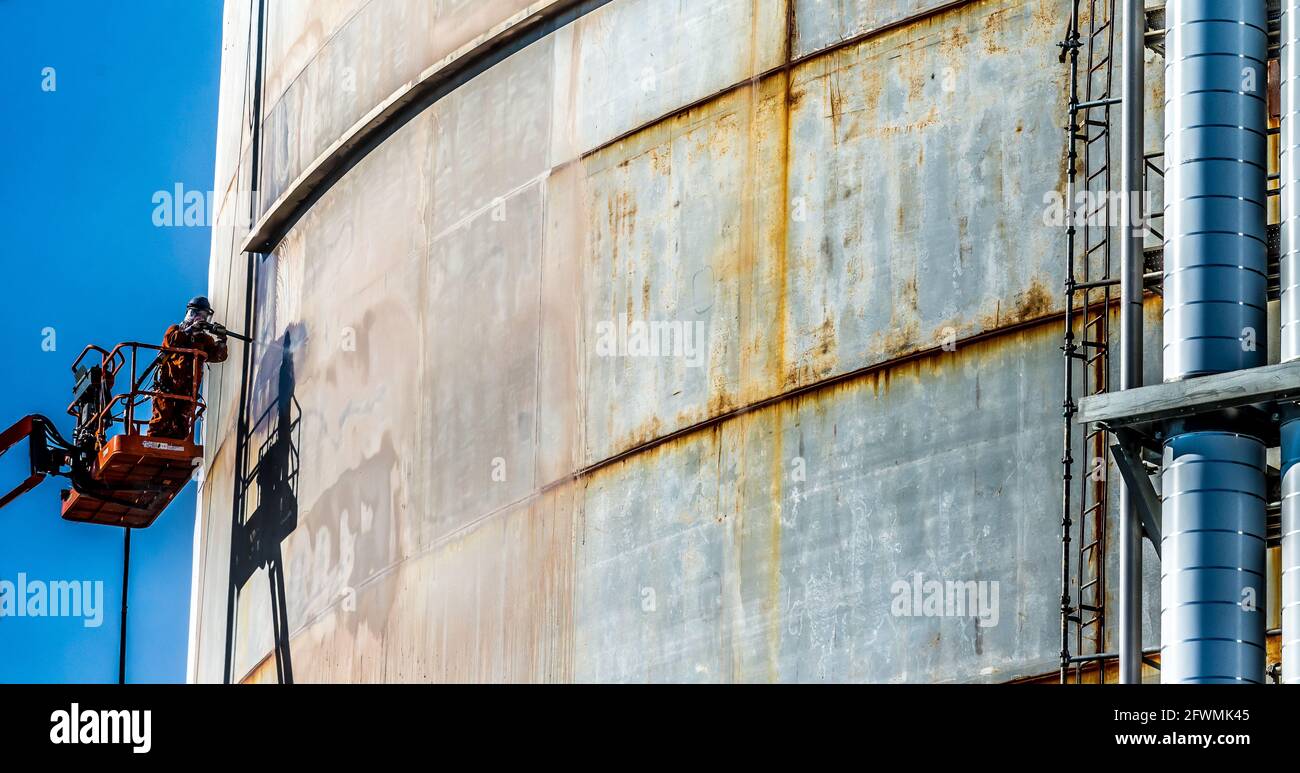 Oil refinery, industrial workers Stock Photo - Alamy