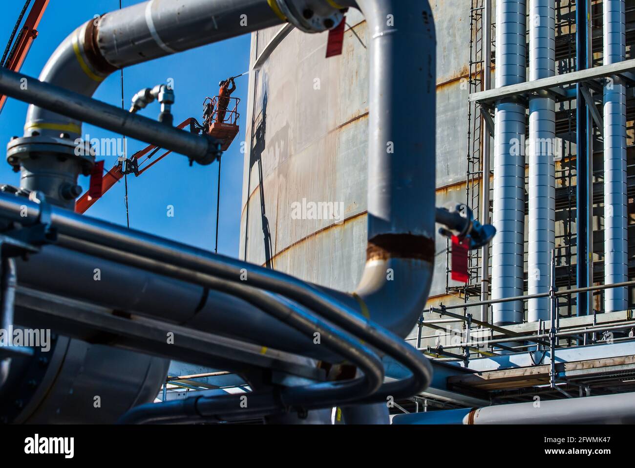 Oil refinery, industrial workers Stock Photo - Alamy