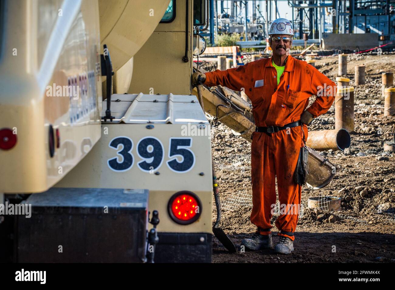 Oil refinery, industrial workers Stock Photo - Alamy