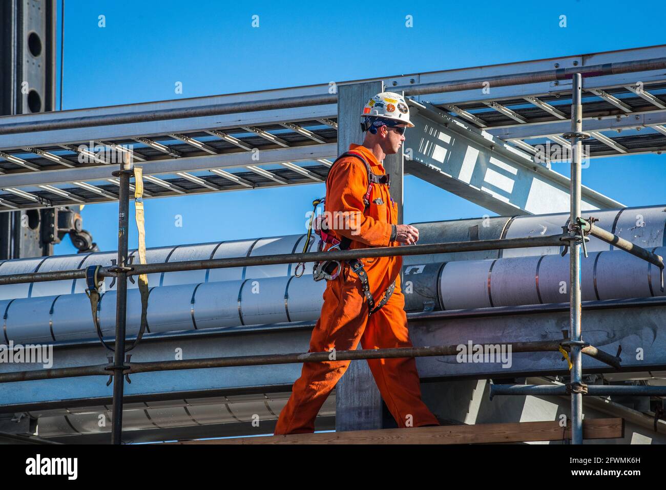 Oil refinery, industrial workers Stock Photo - Alamy