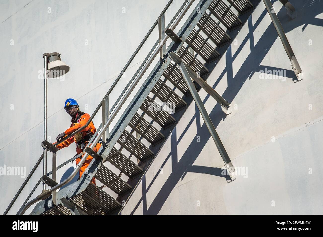 Oil refinery, industrial workers Stock Photo - Alamy