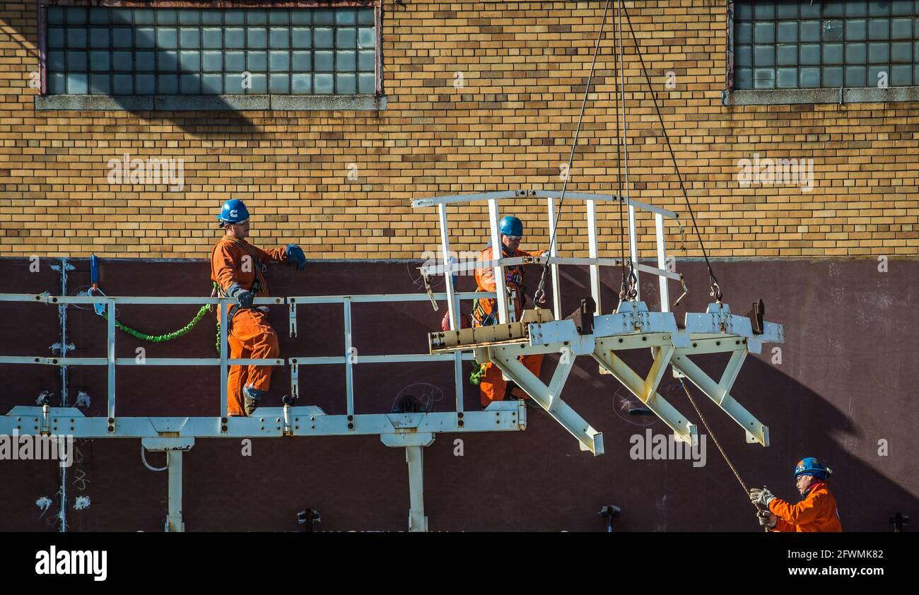 Oil refinery, industrial workers Stock Photo - Alamy