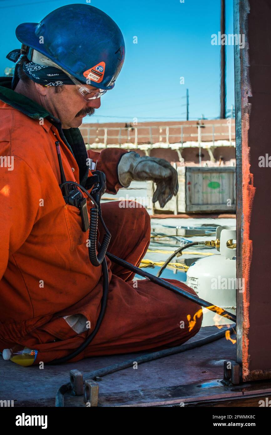 Oil refinery, industrial workers Stock Photo - Alamy