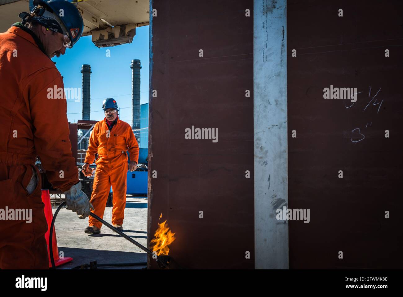 Oil refinery, industrial workers Stock Photo - Alamy