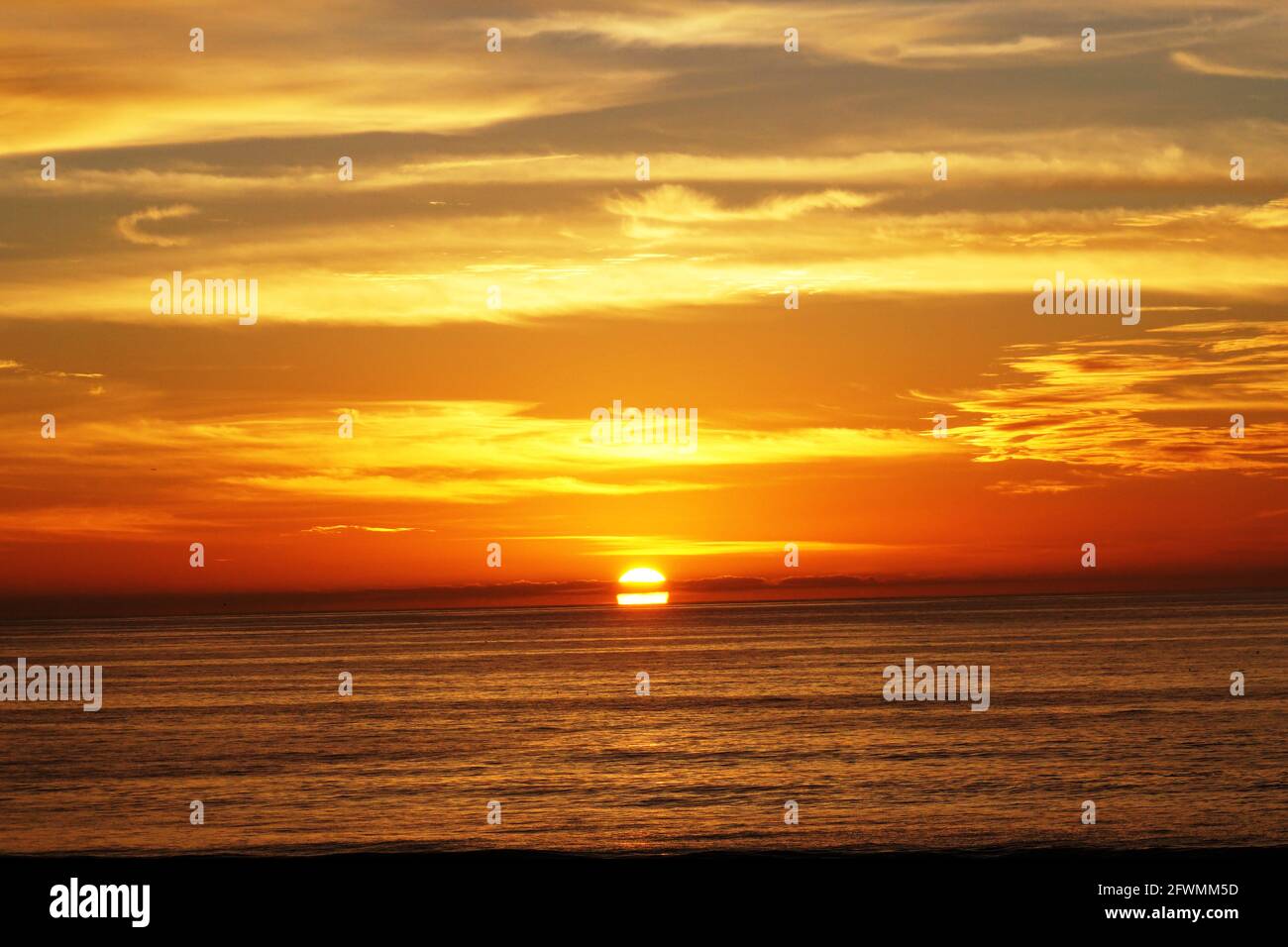 Pacific Ocean Sunset in sequence. One of three pictures of a brilliant ...
