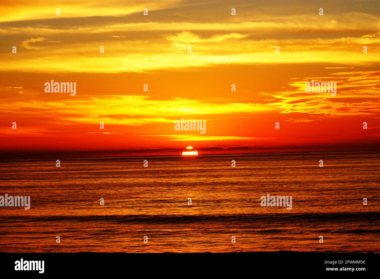 Pacific Ocean Sunset in sequence. One of three pictures of a brilliant ...