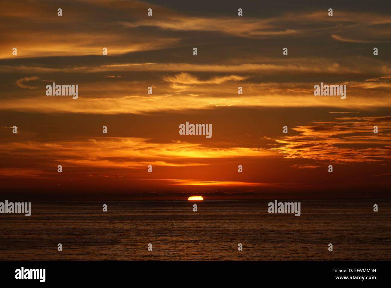 Pacific Ocean Sunset in sequence. One of three pictures of a brilliant ...
