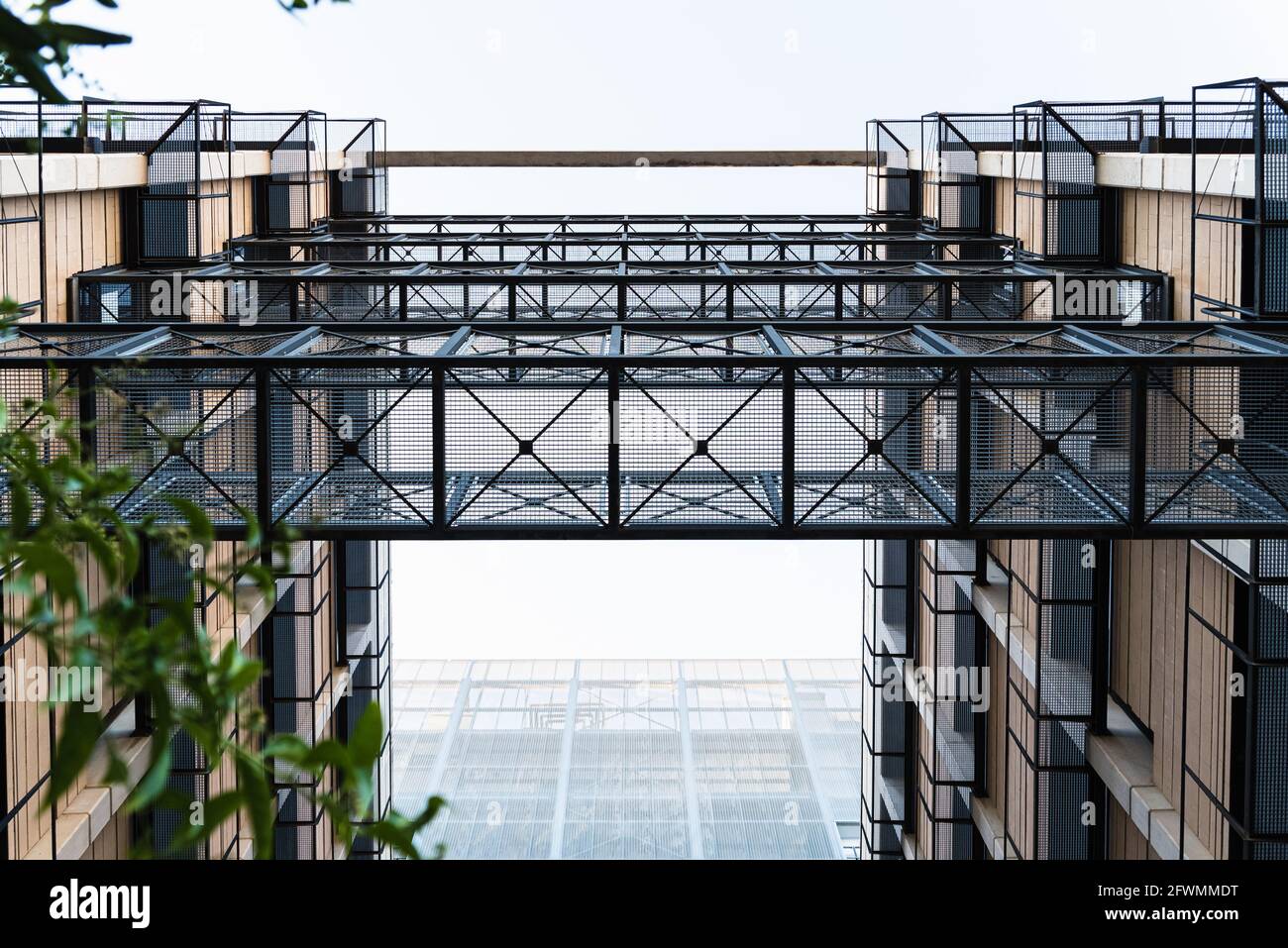 Lattice metal walkways between two modern buildings Stock Photo - Alamy