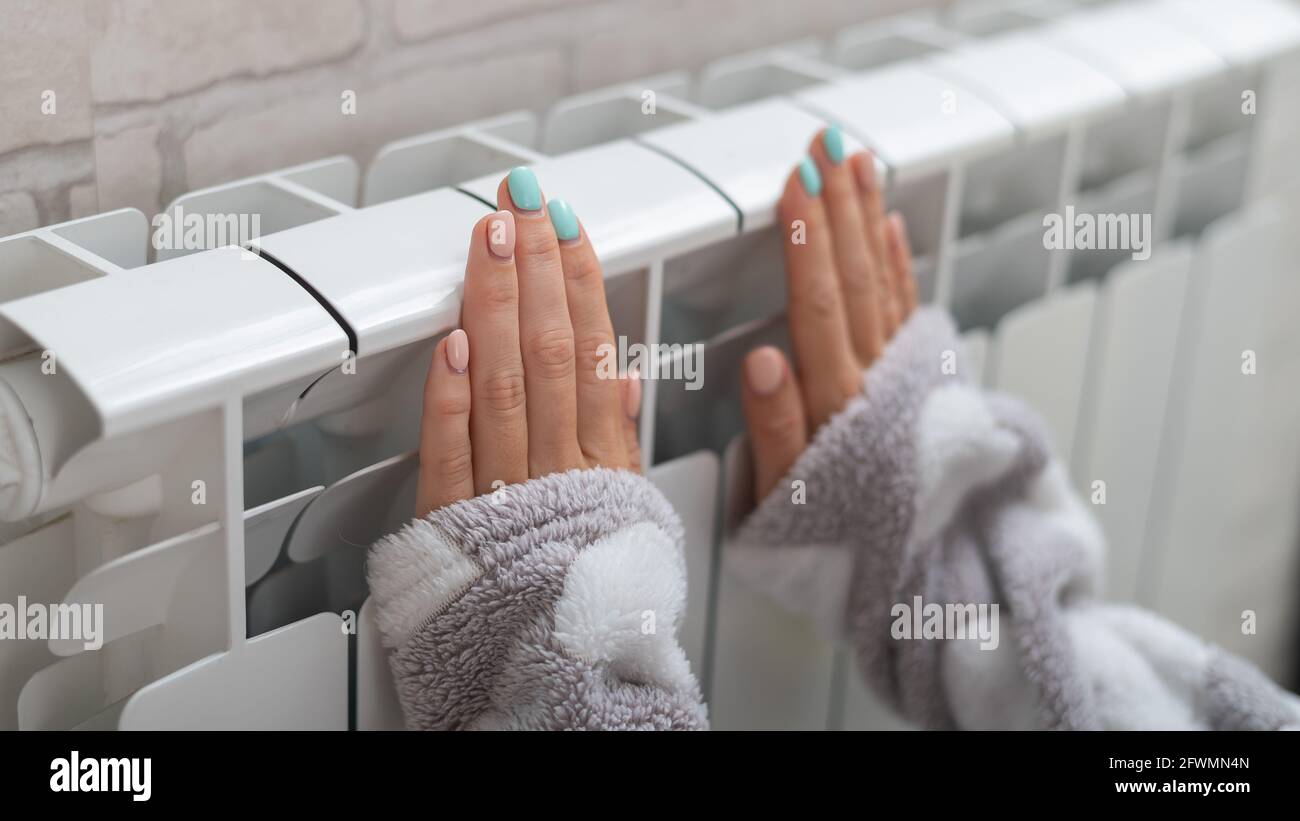 Woman radiator cosy hi-res stock photography and images - Alamy