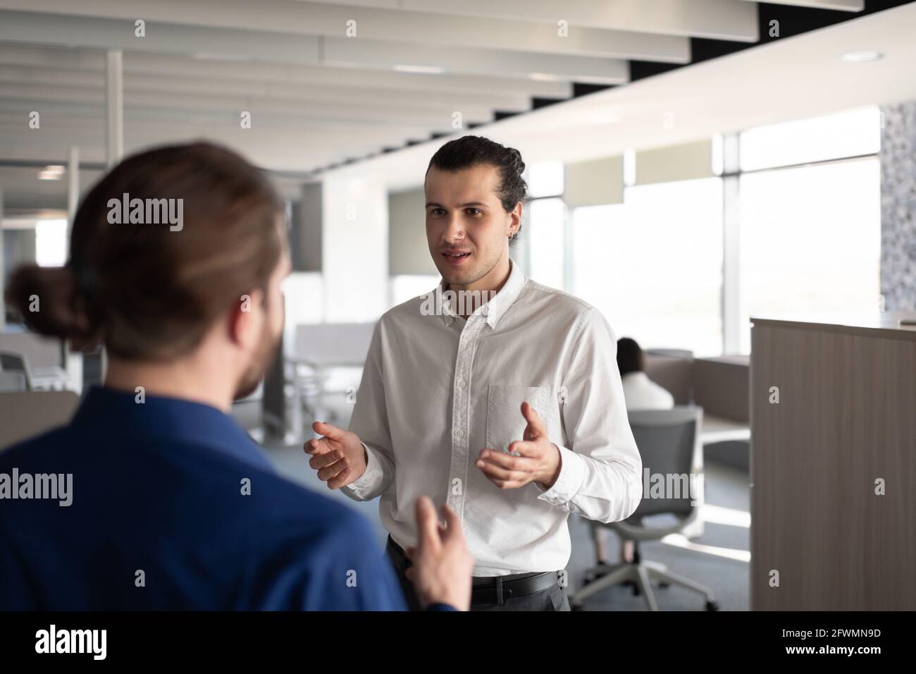 Male leader discussing work team hi-res stock photography and images ...