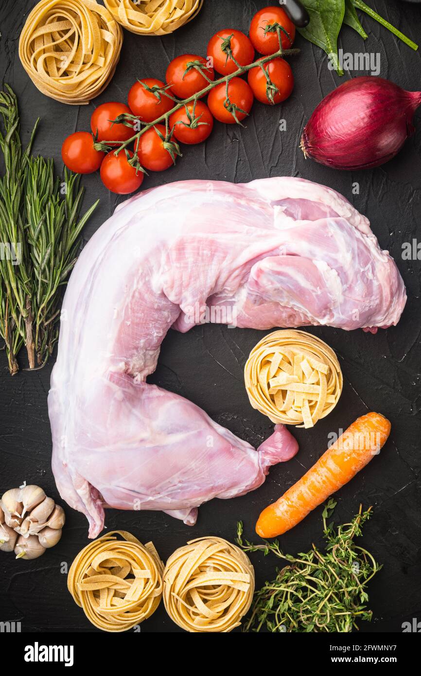 Whole rabbit, Raw meat with spices and vegetables, ingredients for ...