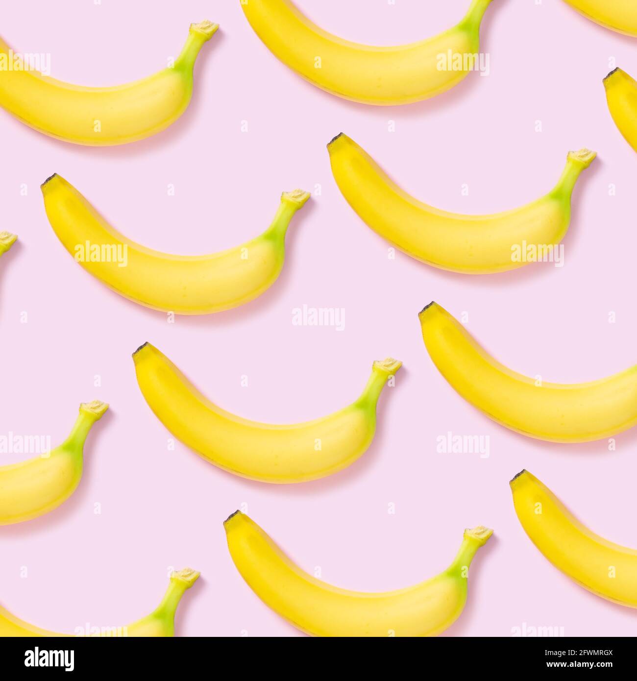 Yellow banana pattern on pink background Stock Photo - Alamy