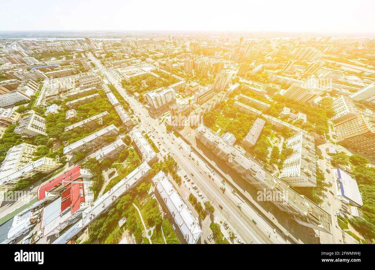 Aerial city view with crossroads and roads, houses, buildings, parks ...