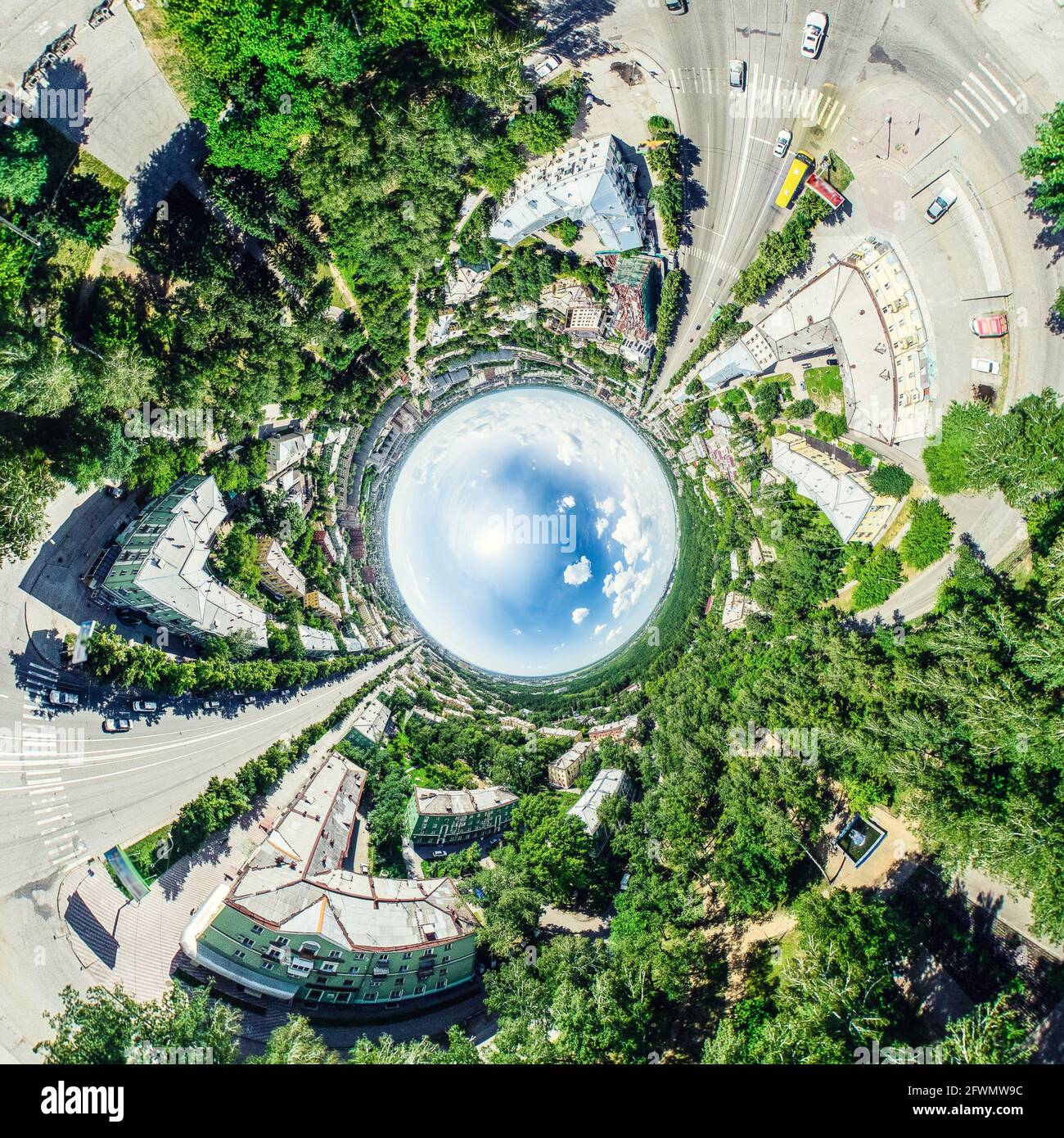 Aerial city view with crossroads and roads, houses, buildings, parks ...