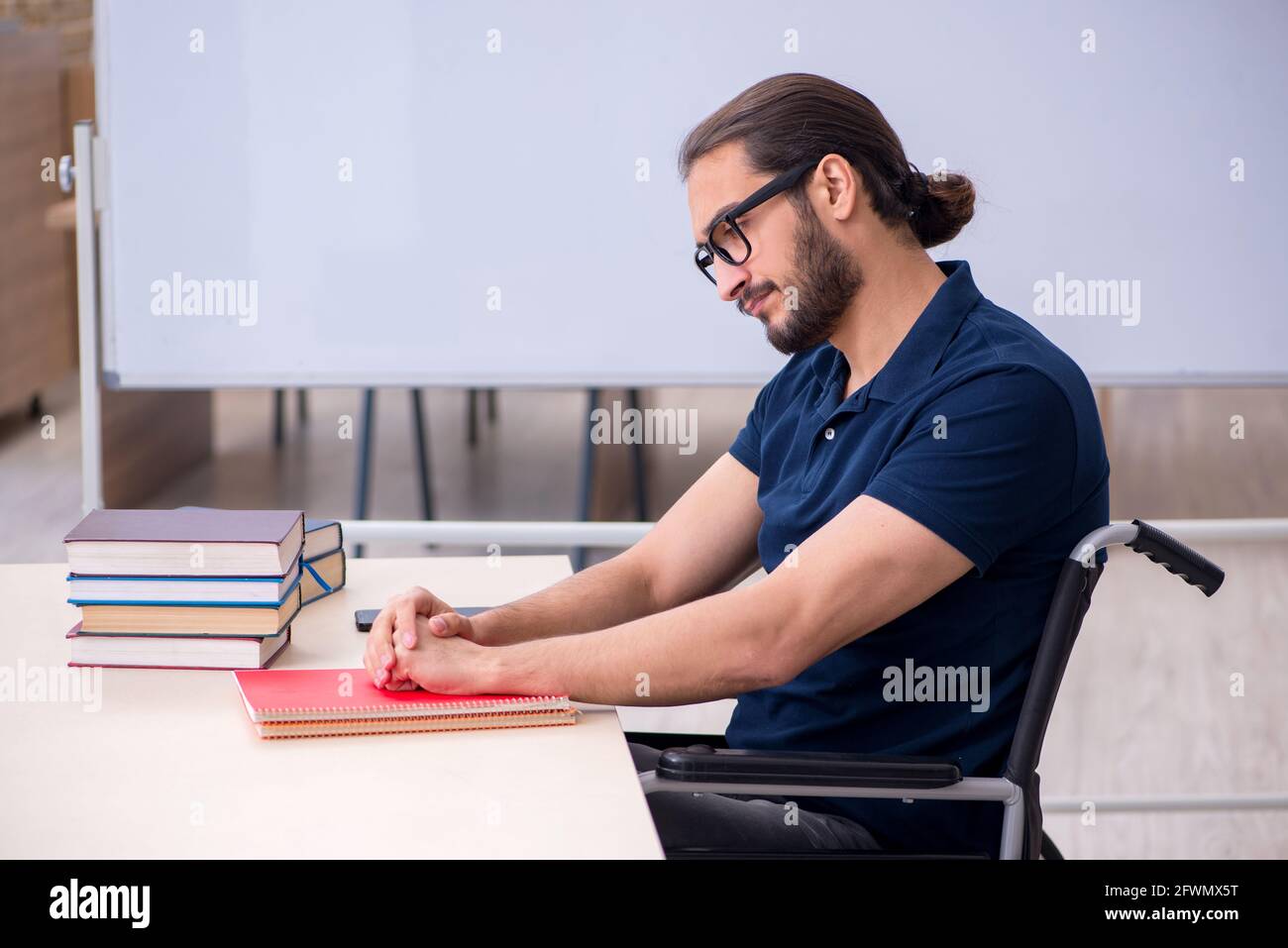 Young handicapped student in the classroom Stock Photo - Alamy