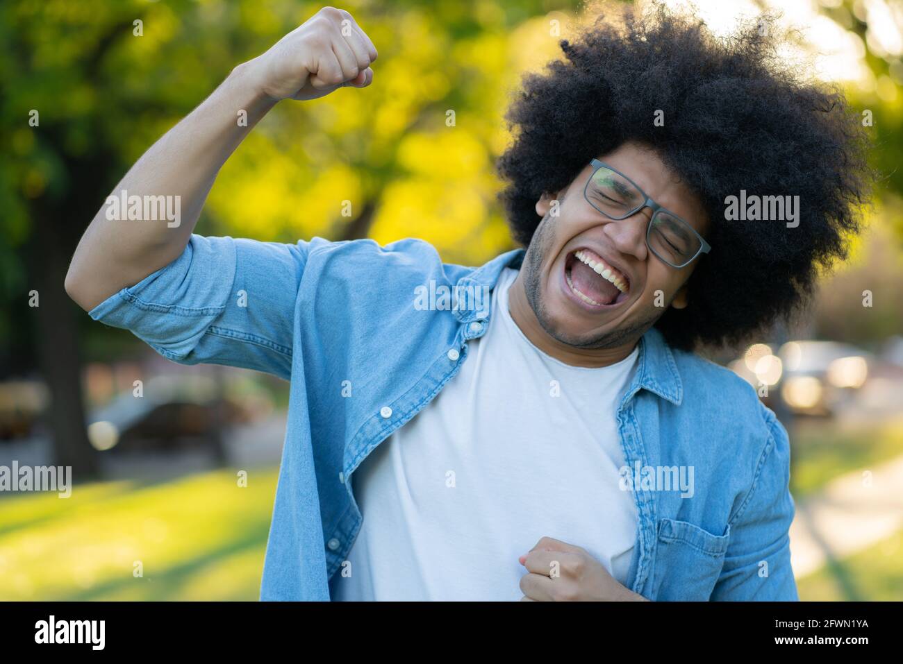 Outdoor portrait young man celebrating hi-res stock photography and ...