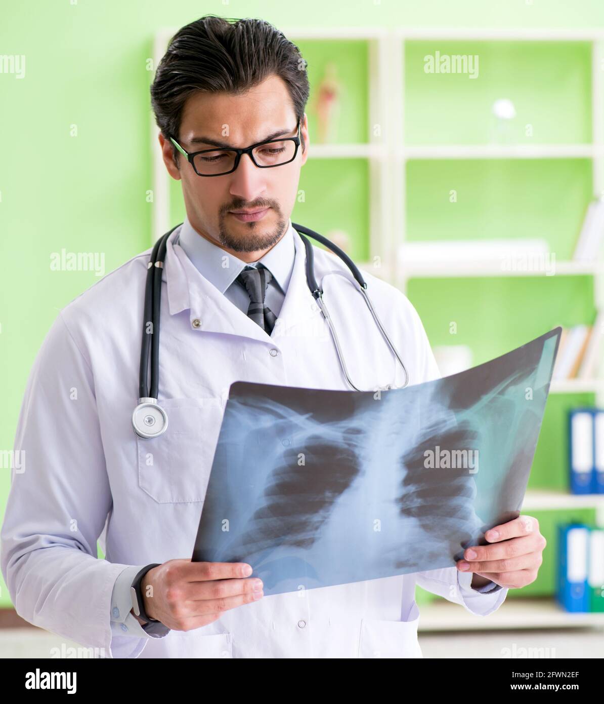 The doctor radiologist looking at x-ray scan in hospital Stock Photo ...