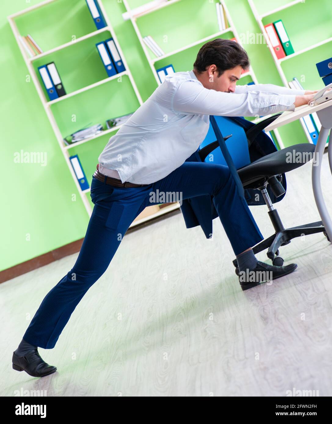 The employee doing exercises during break at work Stock Photo - Alamy