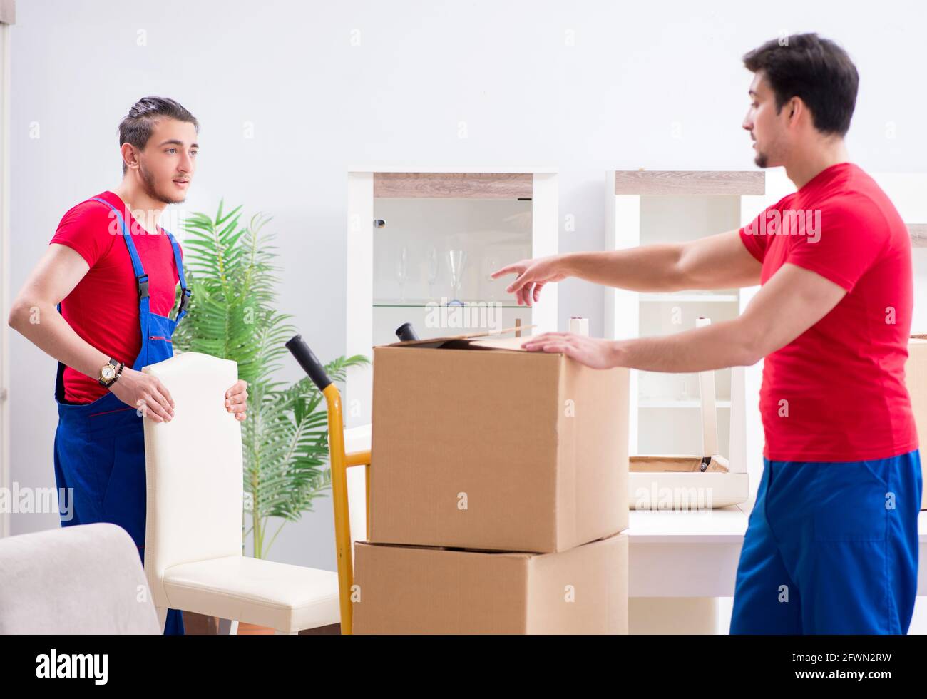 The two contractor employees moving personal belongings Stock Photo - Alamy
