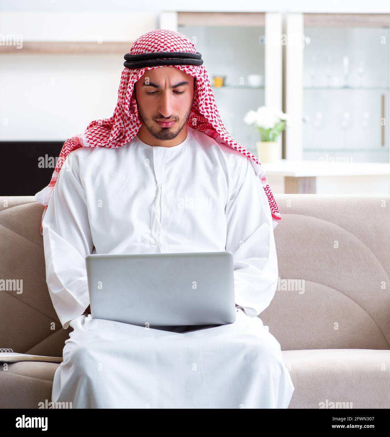 The arab man working at home on his work Stock Photo - Alamy