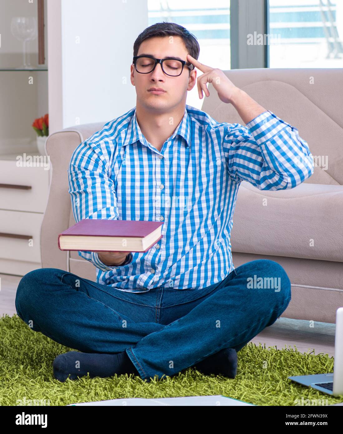 The student meditating and preparing for university exams Stock Photo ...