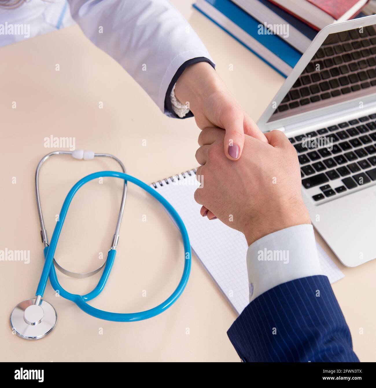 The man signing medical insurance contract Stock Photo - Alamy