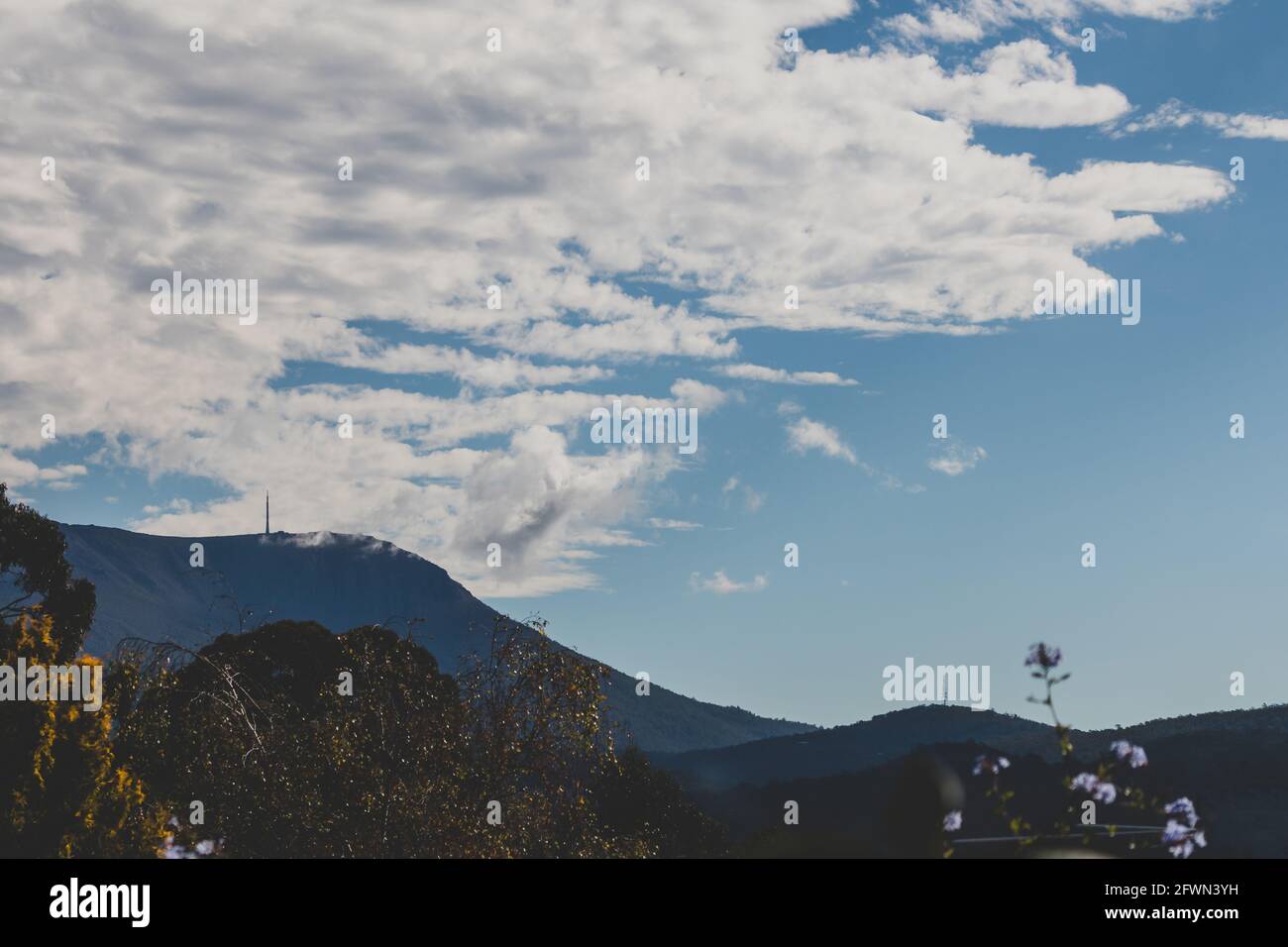 beautiful sky with clouds rolling over the mountains in Tasmania ...
