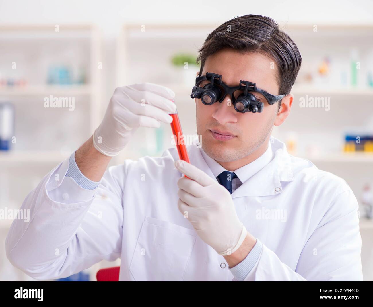 The doctor chemist working on blood samples in lab Stock Photo - Alamy
