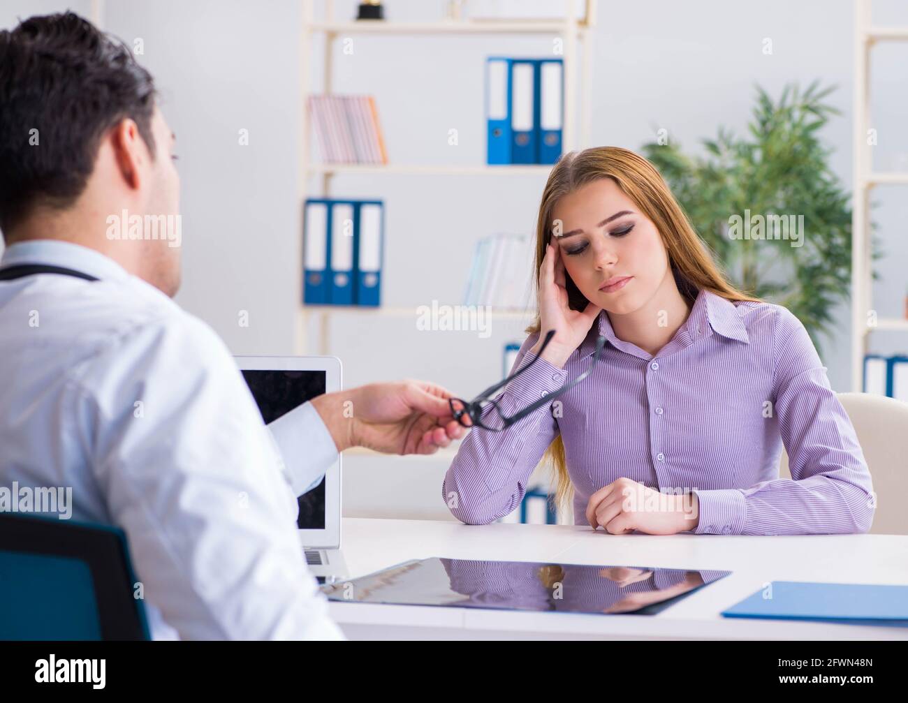The patient visiting doctor for medical check-up in hospital Stock ...