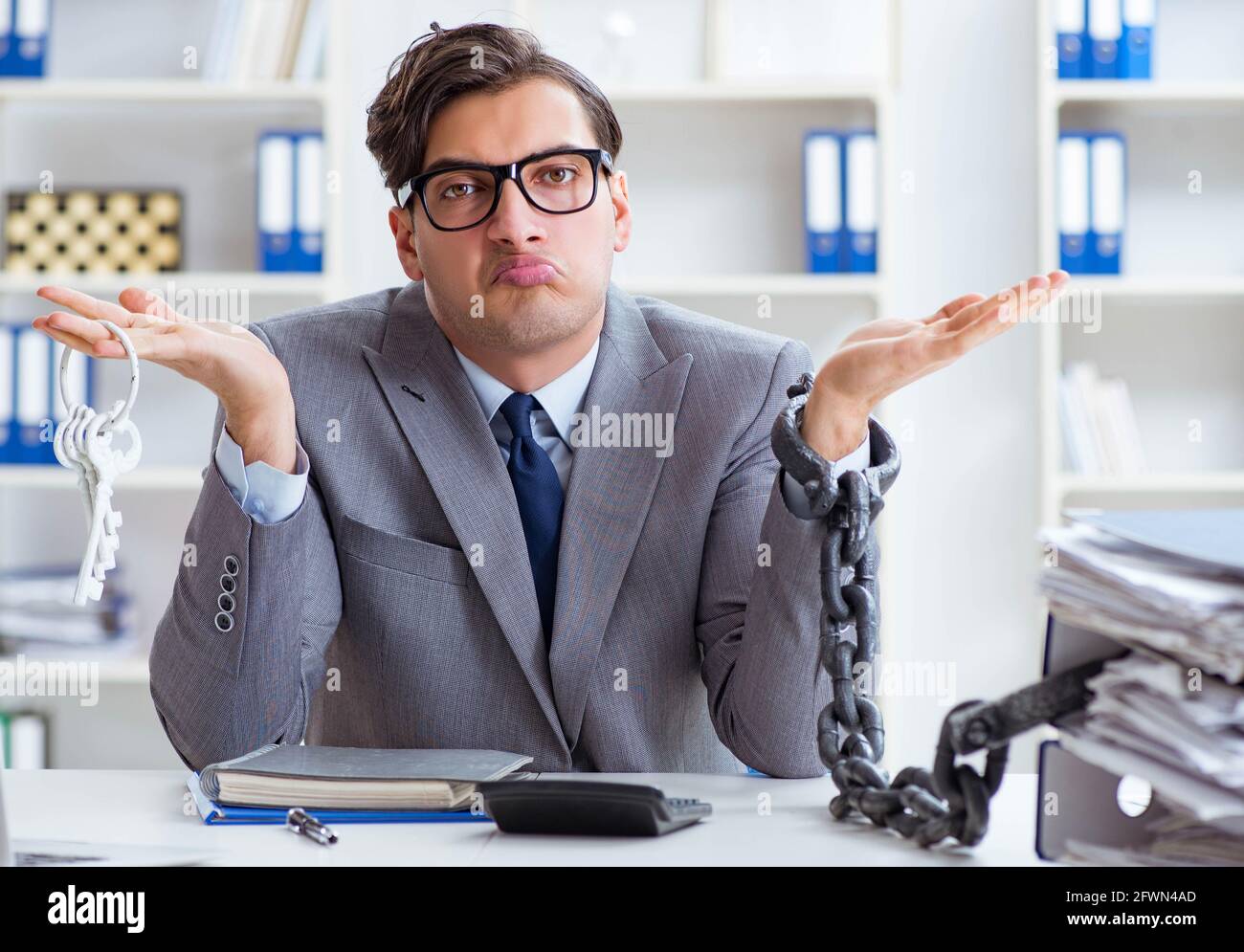 Chained to desk hi-res stock photography and images - Alamy