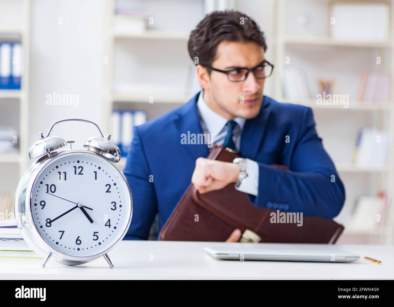 The businessman in bad time management concept Stock Photo - Alamy