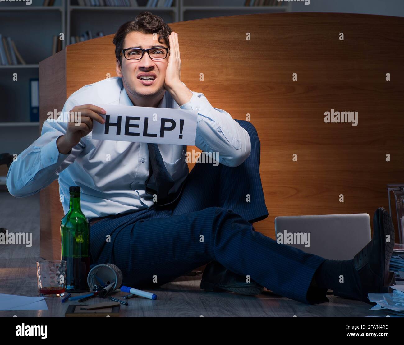 The employee asking for help and drinking under stress and despair ...