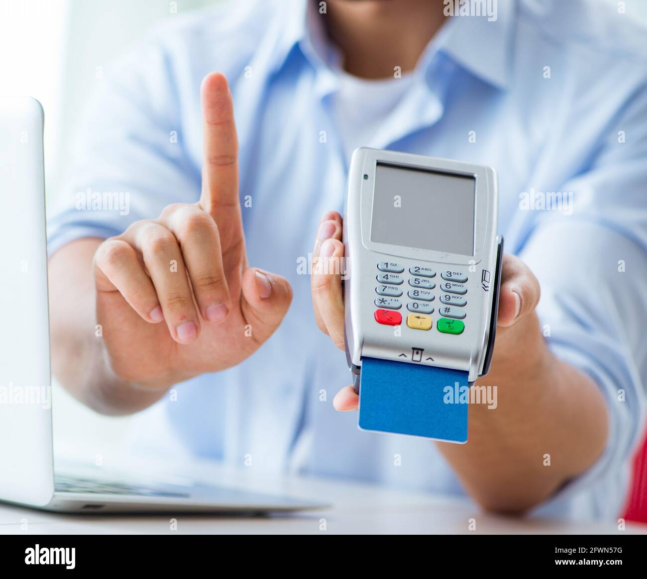 The man processing credit card transaction with pos terminal Stock ...