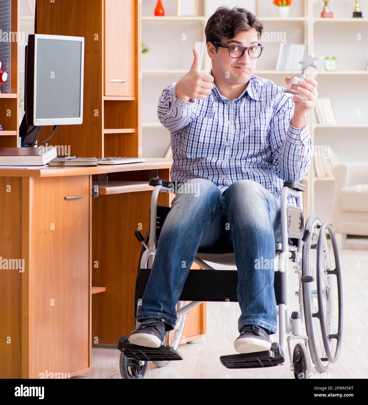 The disabled student studying at home on wheelchair Stock Photo - Alamy