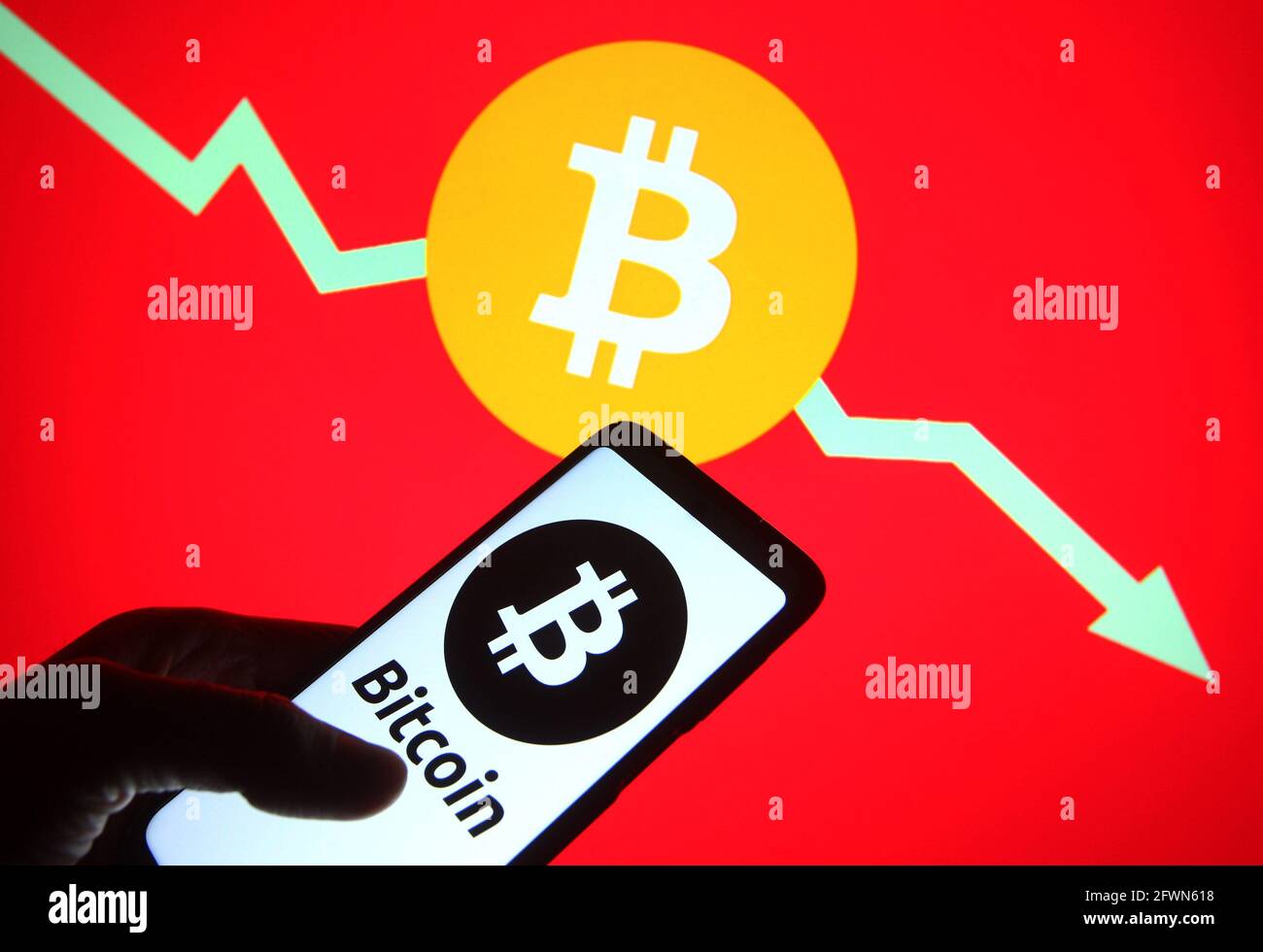 In this photo illustration a Bitcoin (BTC) cryptocurrency logo is seen ...