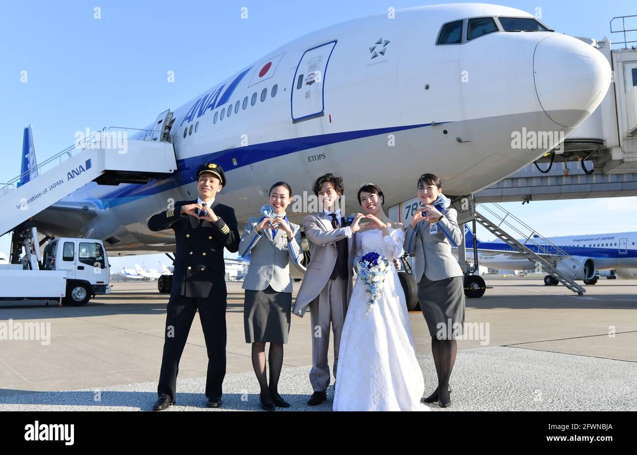 Mr. Toru and Mrs. Mami MURAKAMI with ANA pilot and cabin attendants at ...