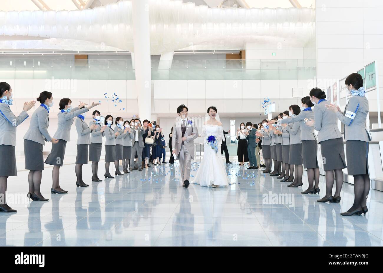 Mr. Toru and Mrs. Mami MURAKAMI are congratulated by attendees and ANA ...