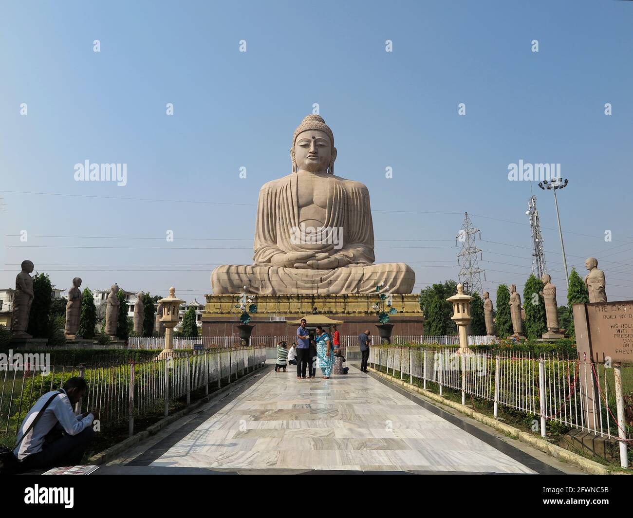 Visitors pose for pictures at the Great Buddha Statue, Bodhgaya, Bihar ...