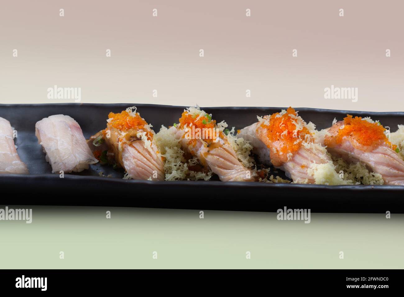 Fresh japanese salmon sushi on long dish Stock Photo - Alamy
