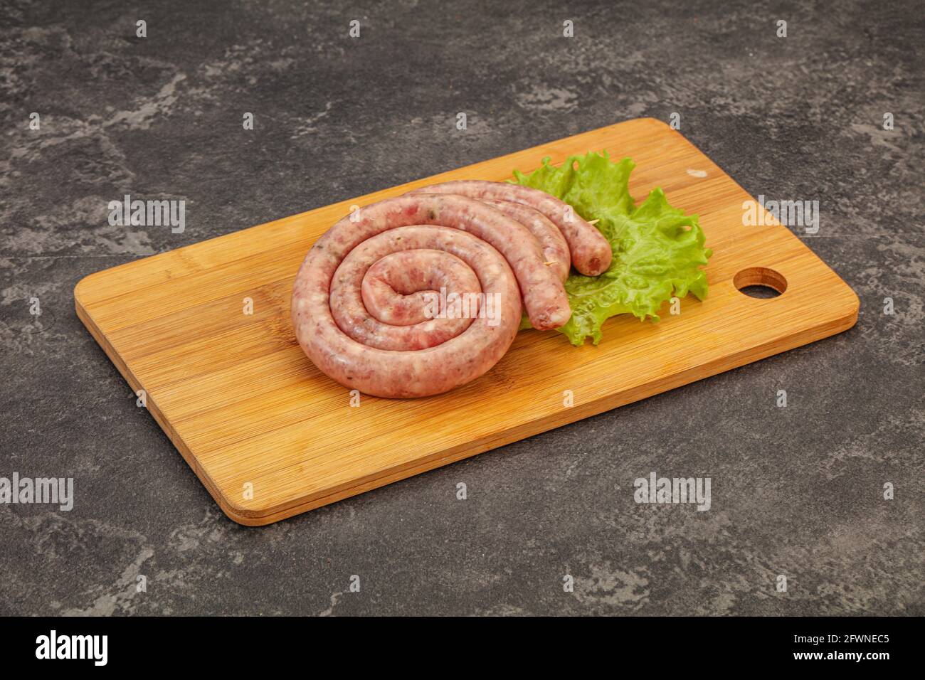 Raw pork sausage ring for grill Stock Photo - Alamy