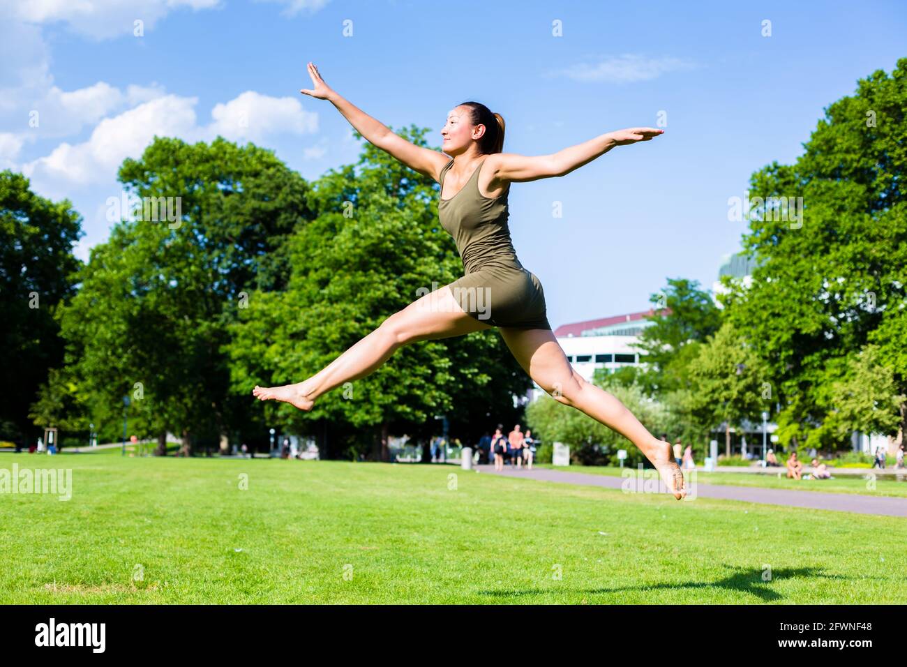 Beautiful woman doing jumping in hi-res stock photography and images ...