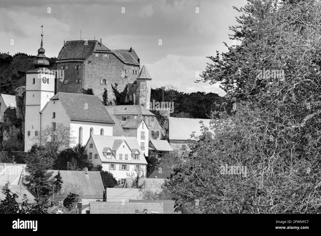 scenic view of a medieval castle behind a church in monochrome Stock ...
