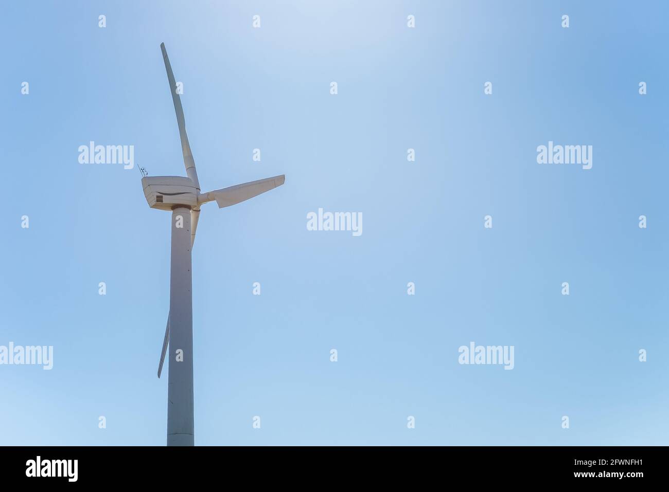 Wind power,one wind turbine and blue sky.wind power concept with copy ...