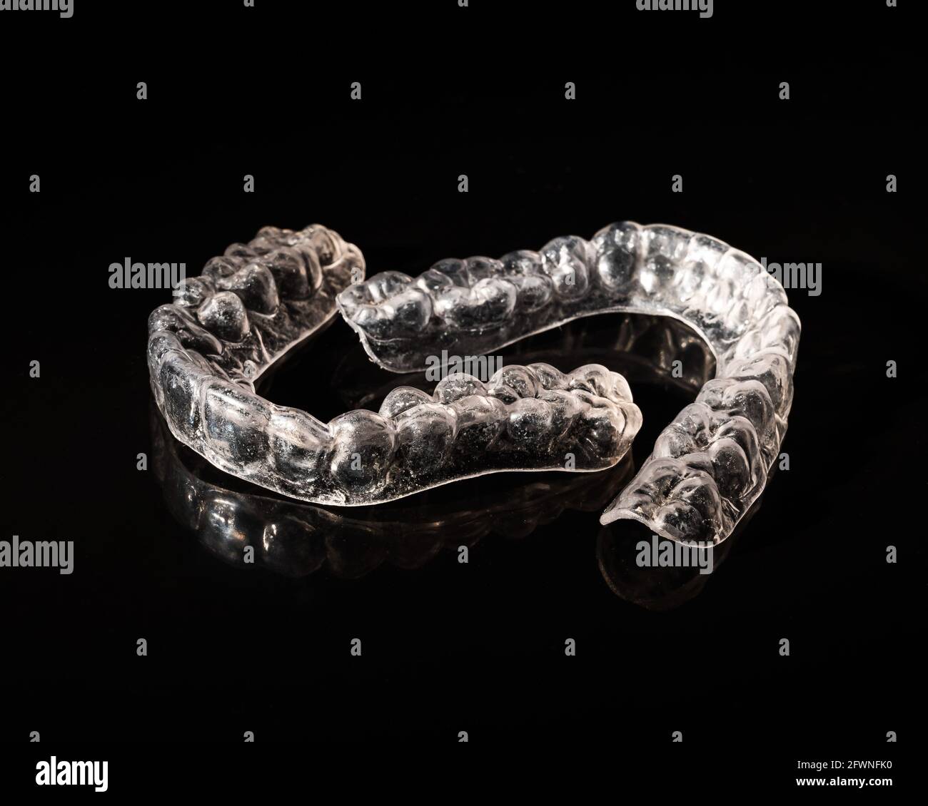 Removable plastic retainers on black background Stock Photo - Alamy